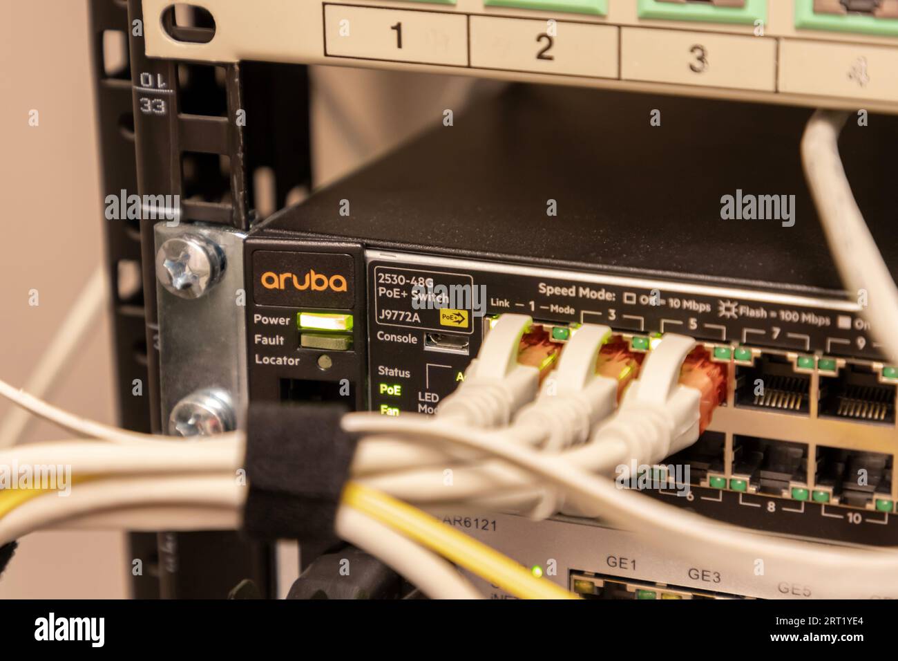 Aruba 2530 48G PoE+ Ethernet switch installed in a rack Stock Photo - Alamy