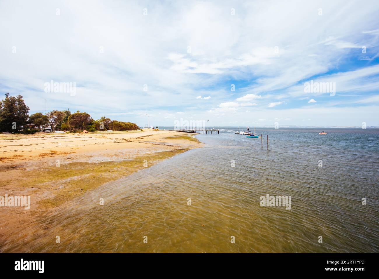 The quaint seaside fishing town of Rhyll with main beach and jetty in ...