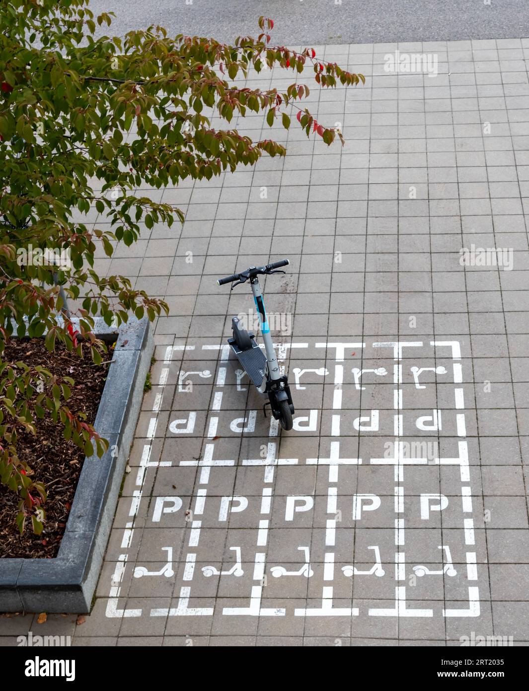 E-scooter parking area on a pavement in Talvikkitie Stock Photo - Alamy