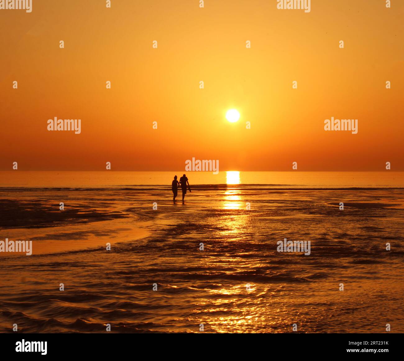 Romantic Sunset Beach Stroll Stock Photo - Alamy