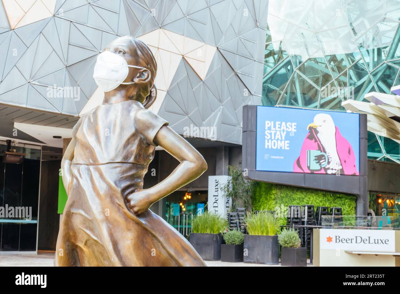 Melbourne, Australia, October 10th 2020: Federation Square and a masked ...