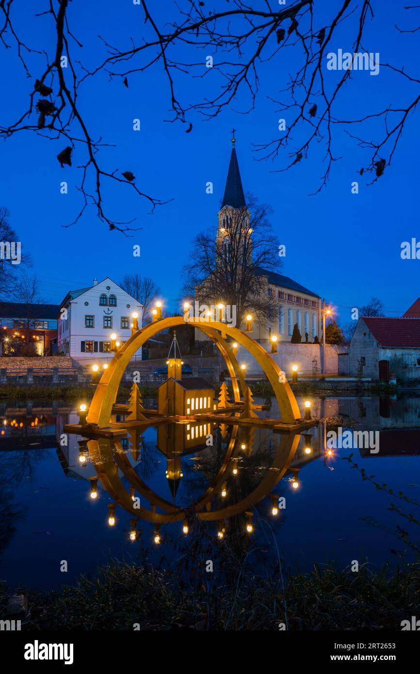 Floating candle arch in the village pond of Baernsdorf near Moritzburg ...