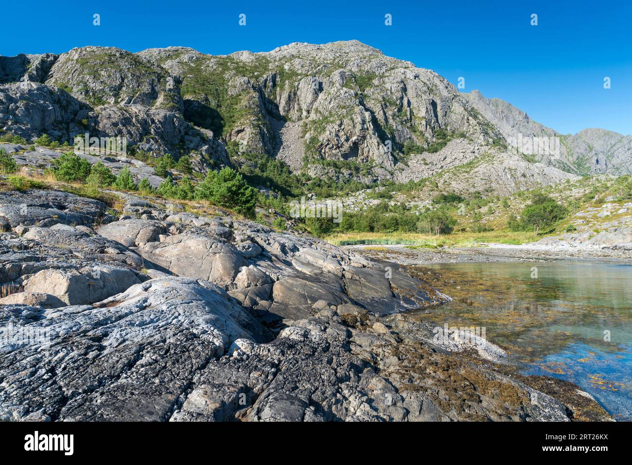 Beach of Ervika and Trollvasstinden on the island of Vega, Norway Stock ...