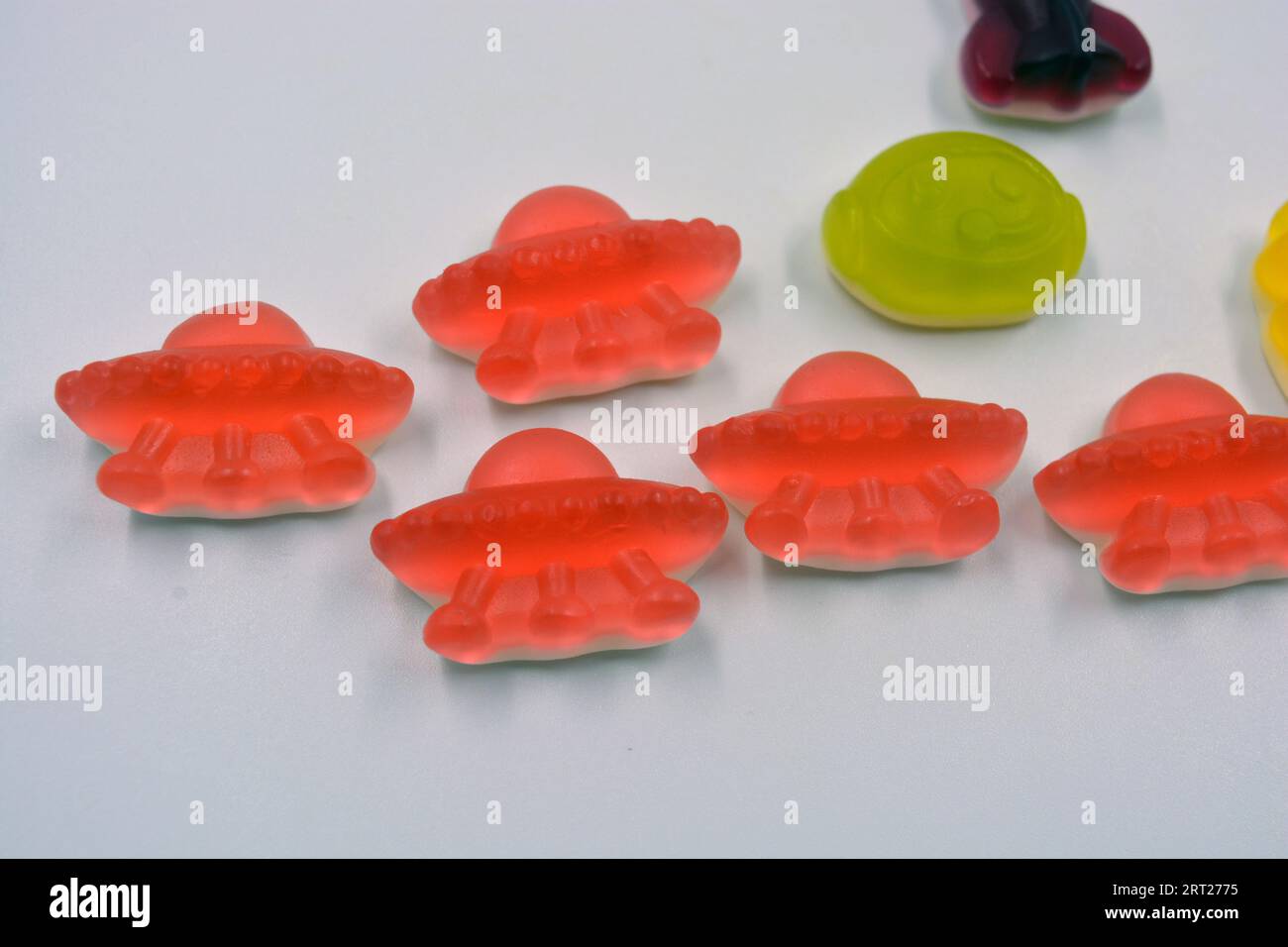 Beautiful and bright colored sweets in the form of various alien ...