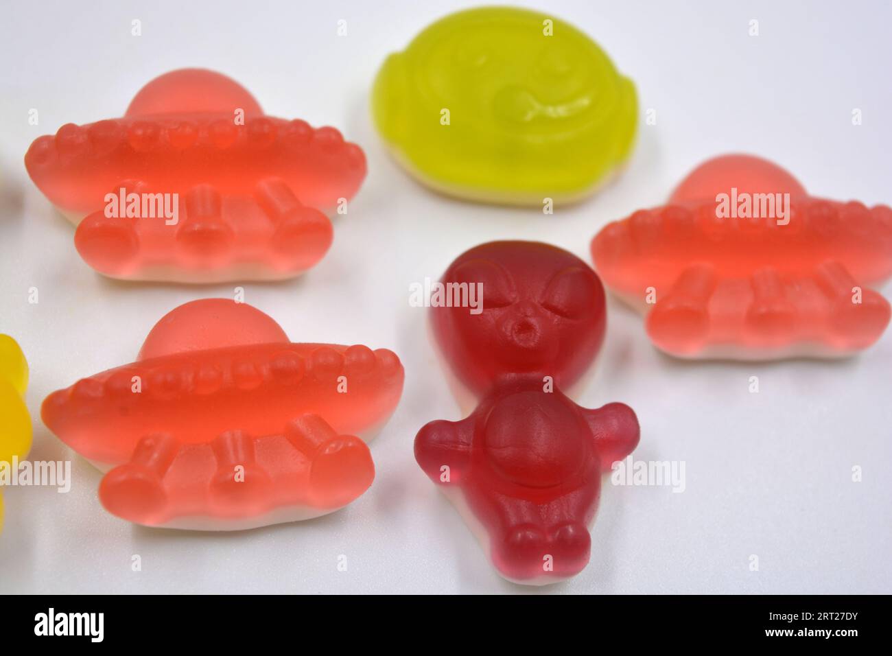 Beautiful and bright colored sweets in the form of various alien ...