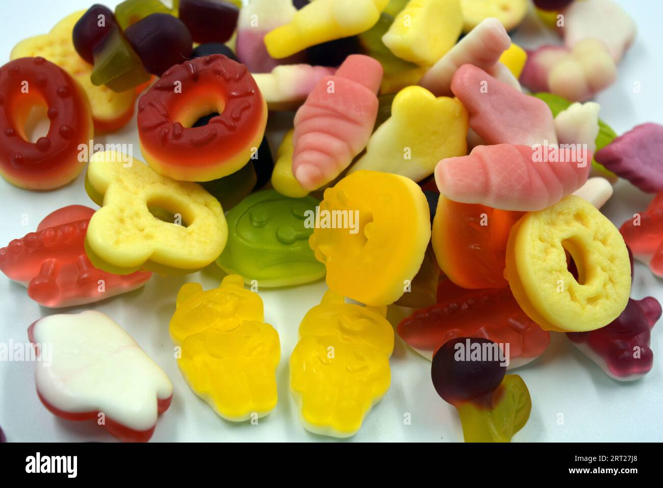 Bright, juicy and unusual jelly, gummies, sweets of different shapes ...