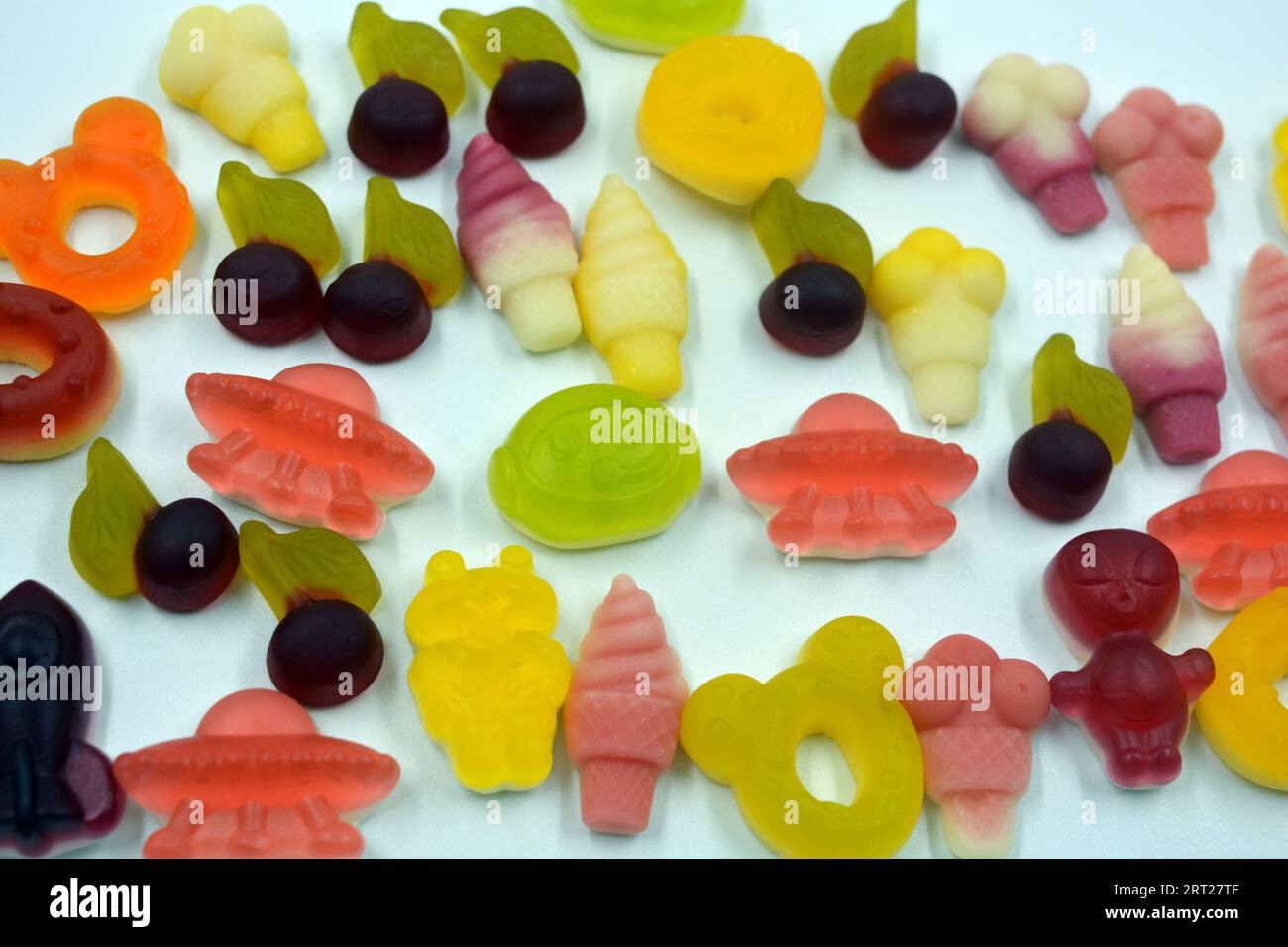 Bright, juicy and unusual jelly, gummies, sweets of different shapes ...