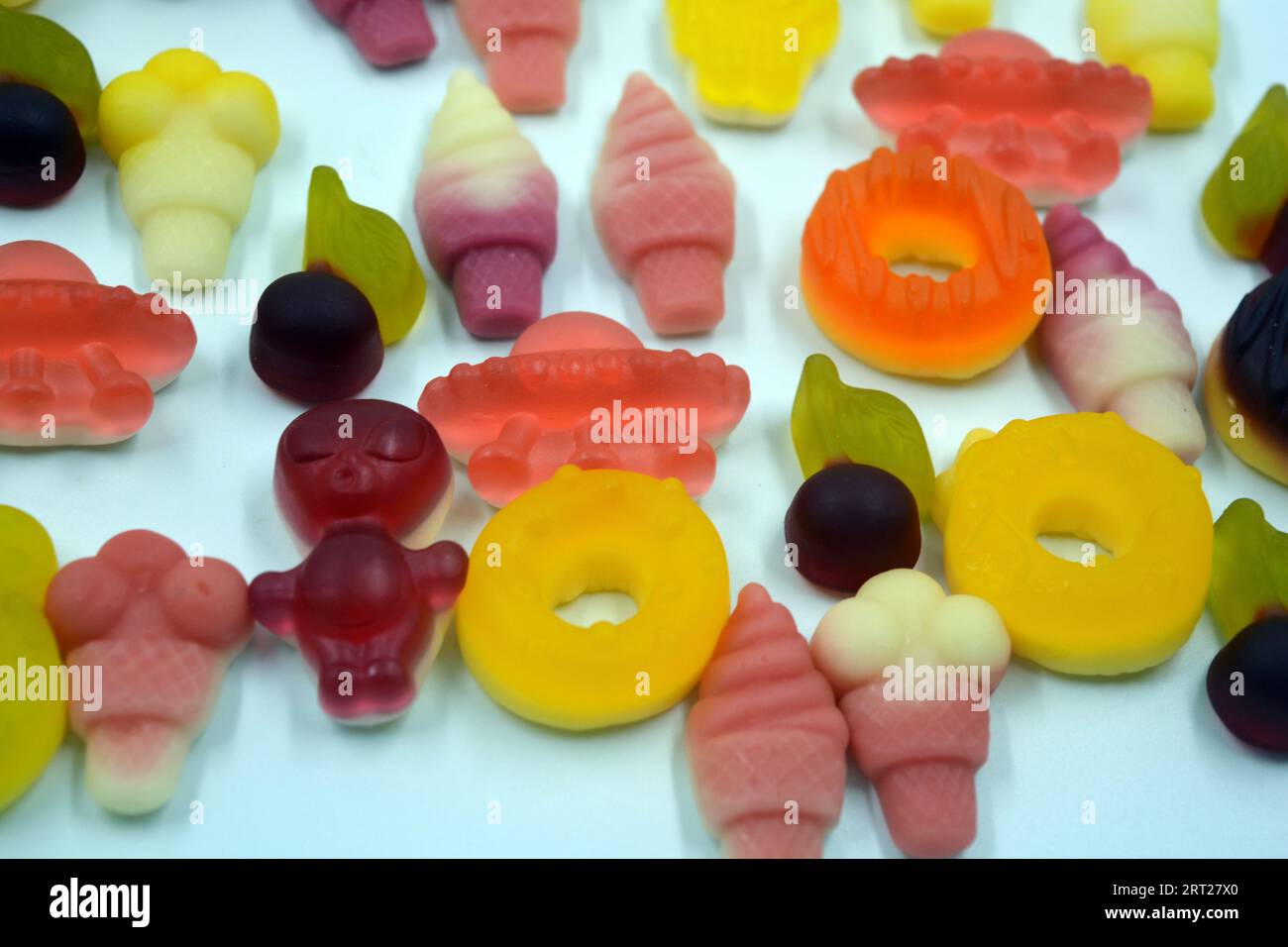 Bright, juicy and unusual jelly, gummies, sweets of different shapes ...