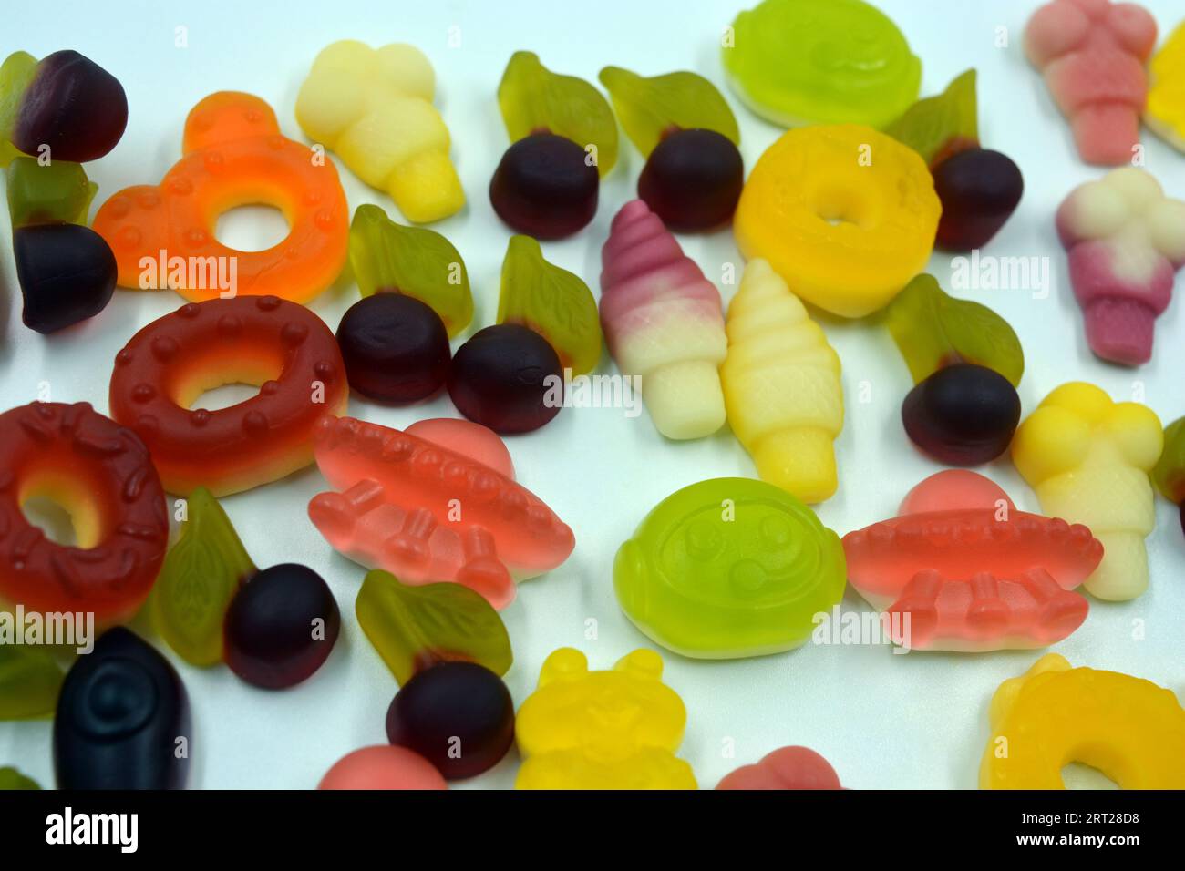 Bright, juicy and unusual jelly, gummies, sweets of different shapes ...