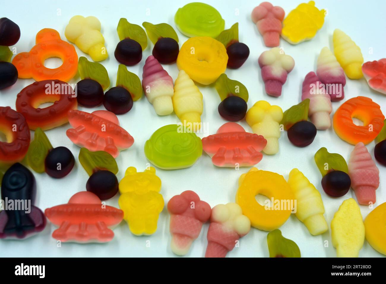 Bright, juicy and unusual jelly, gummies, sweets of different shapes ...