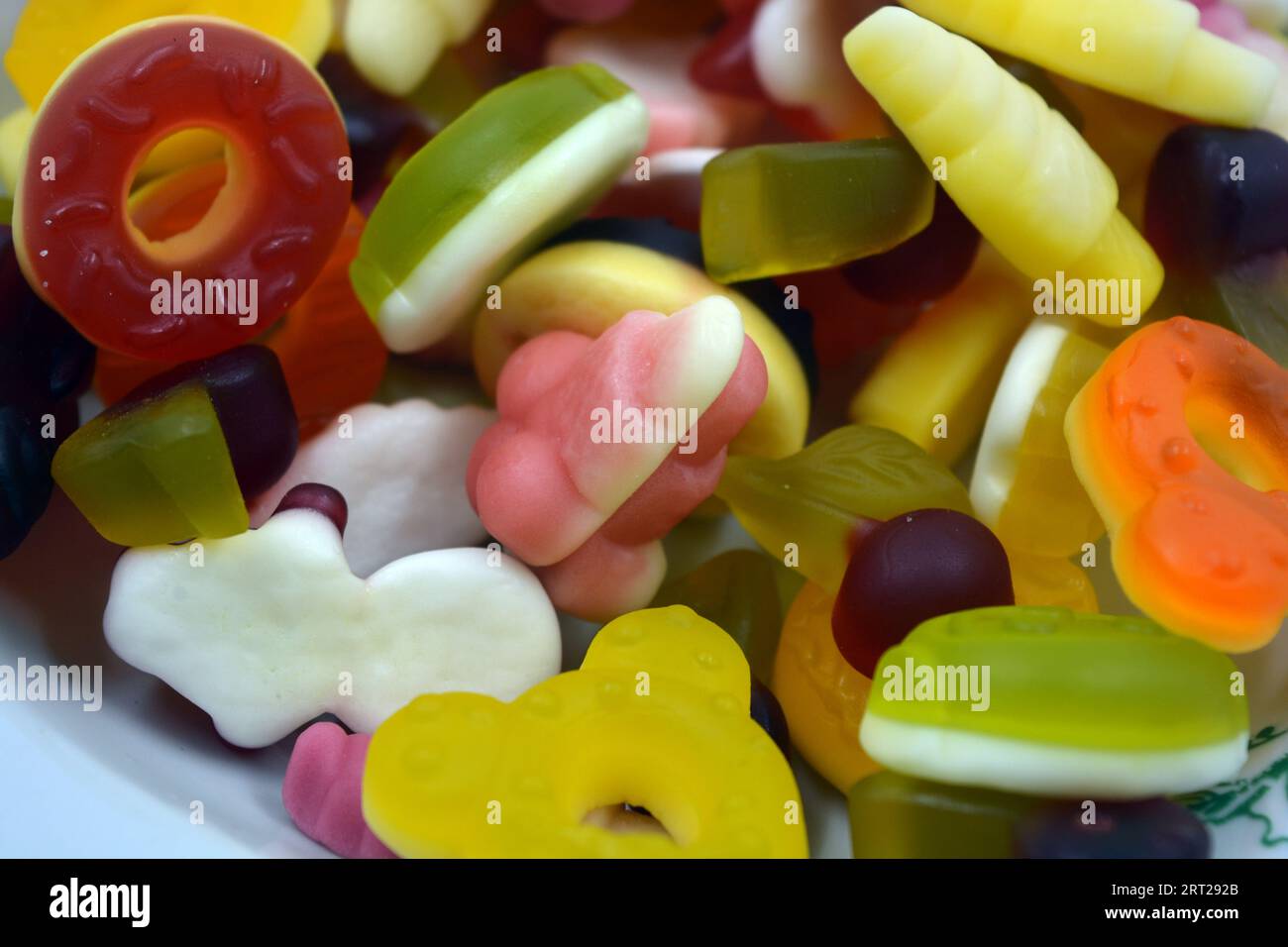 Bright, juicy and unusual jelly, gummies, sweets of different shapes ...