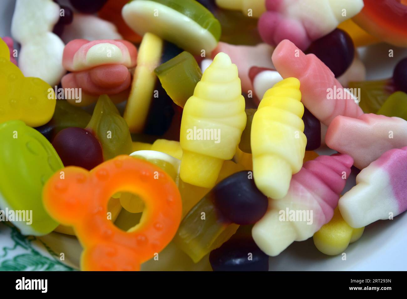 Bright, juicy and unusual jelly, gummies, sweets of different shapes ...