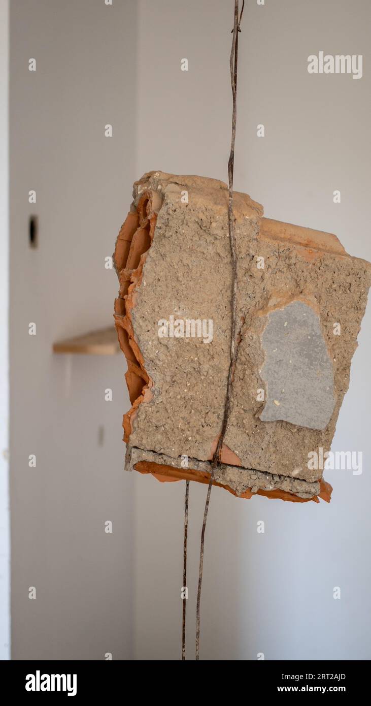 apartment renovation piece of wall hanging on reinforcement Stock Photo ...
