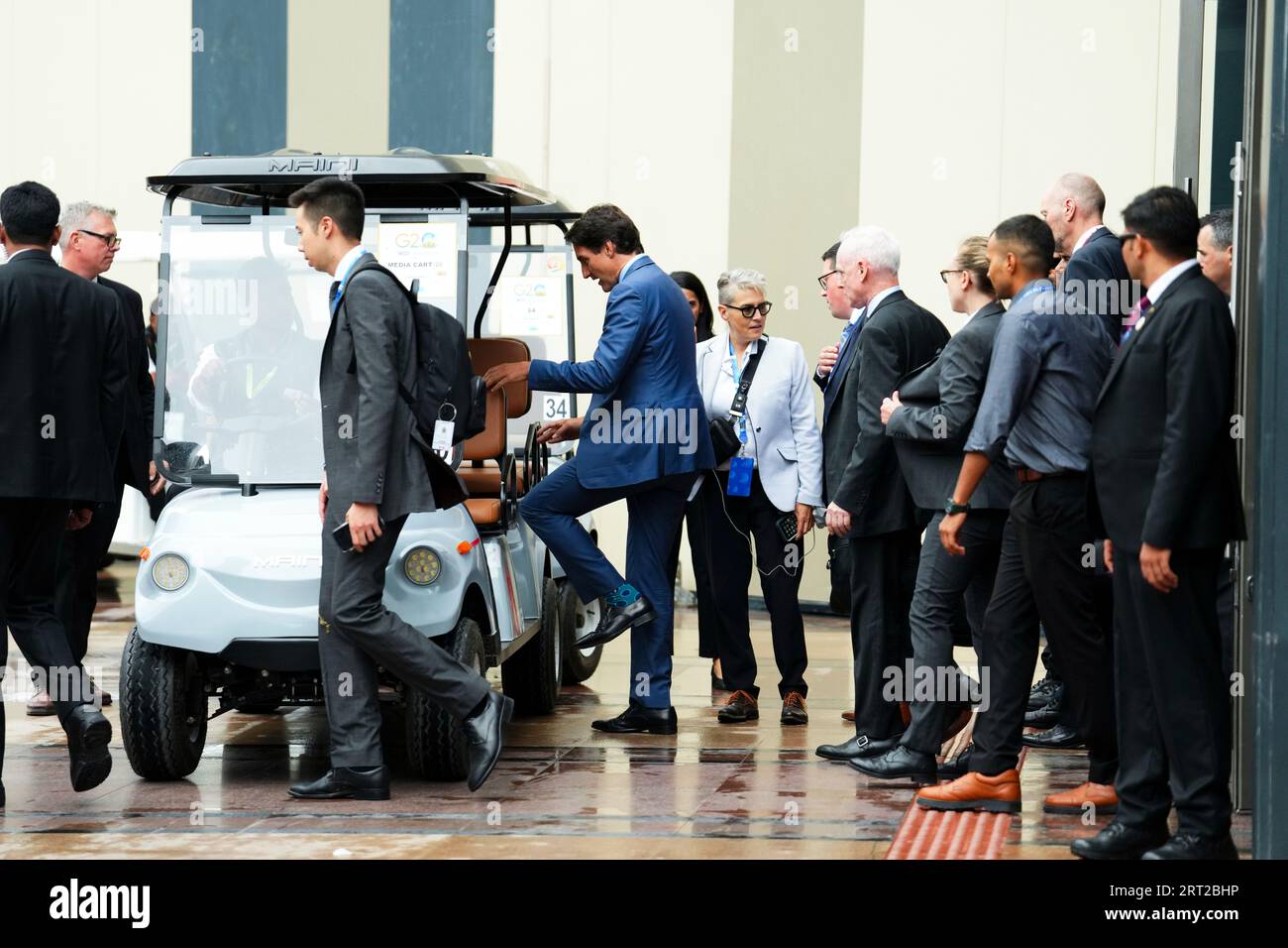 Prime Minister Justin Trudeau loads onto a golf cart after holding a ...