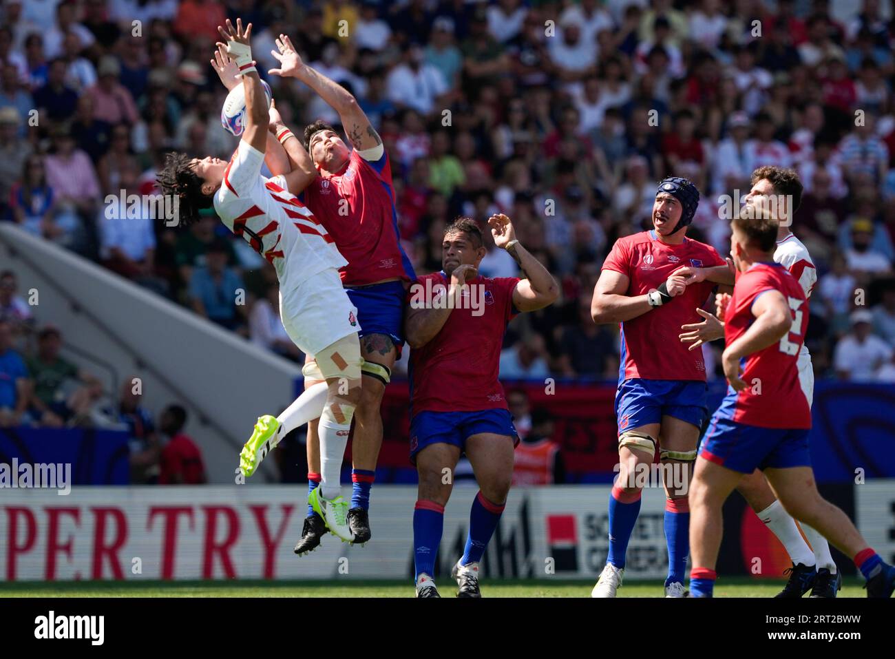 Japan's Shota Fukui, left, and Chile's Clemente Saavedra compete for ...