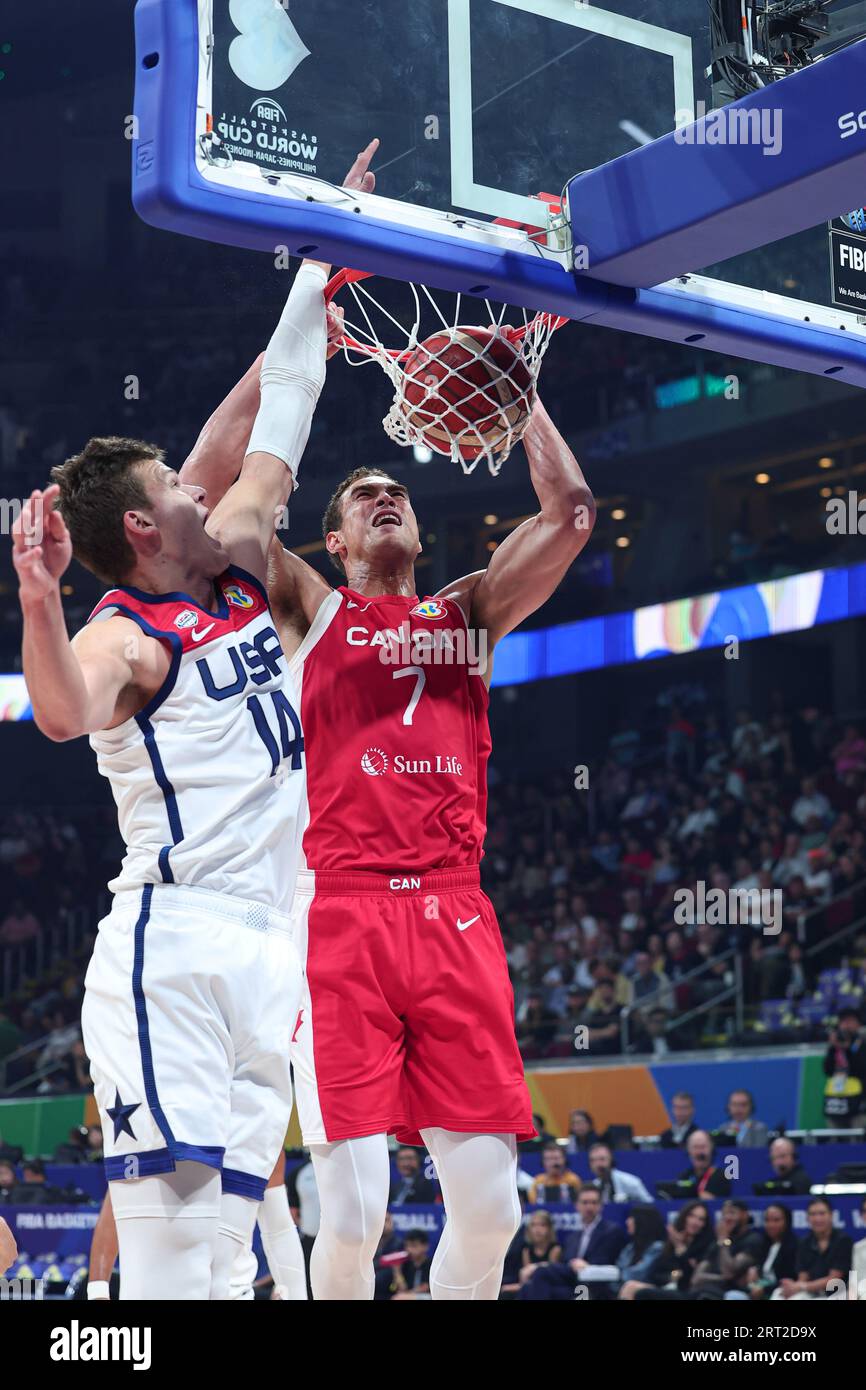 Manila, Philippines. 10th Sep, 2023. Dwight Powell (R) of Canada dunks ...