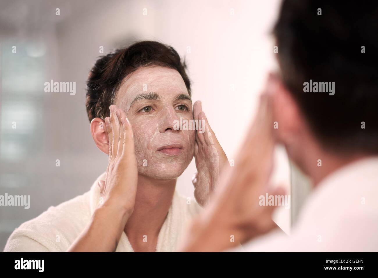 Young man washing face hi-res stock photography and images - Alamy