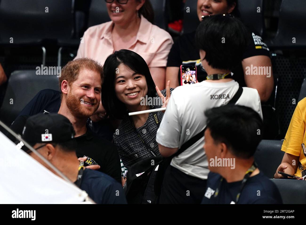 The Duke of Sussex poses for a picture with fans at the Merkur Spiel ...