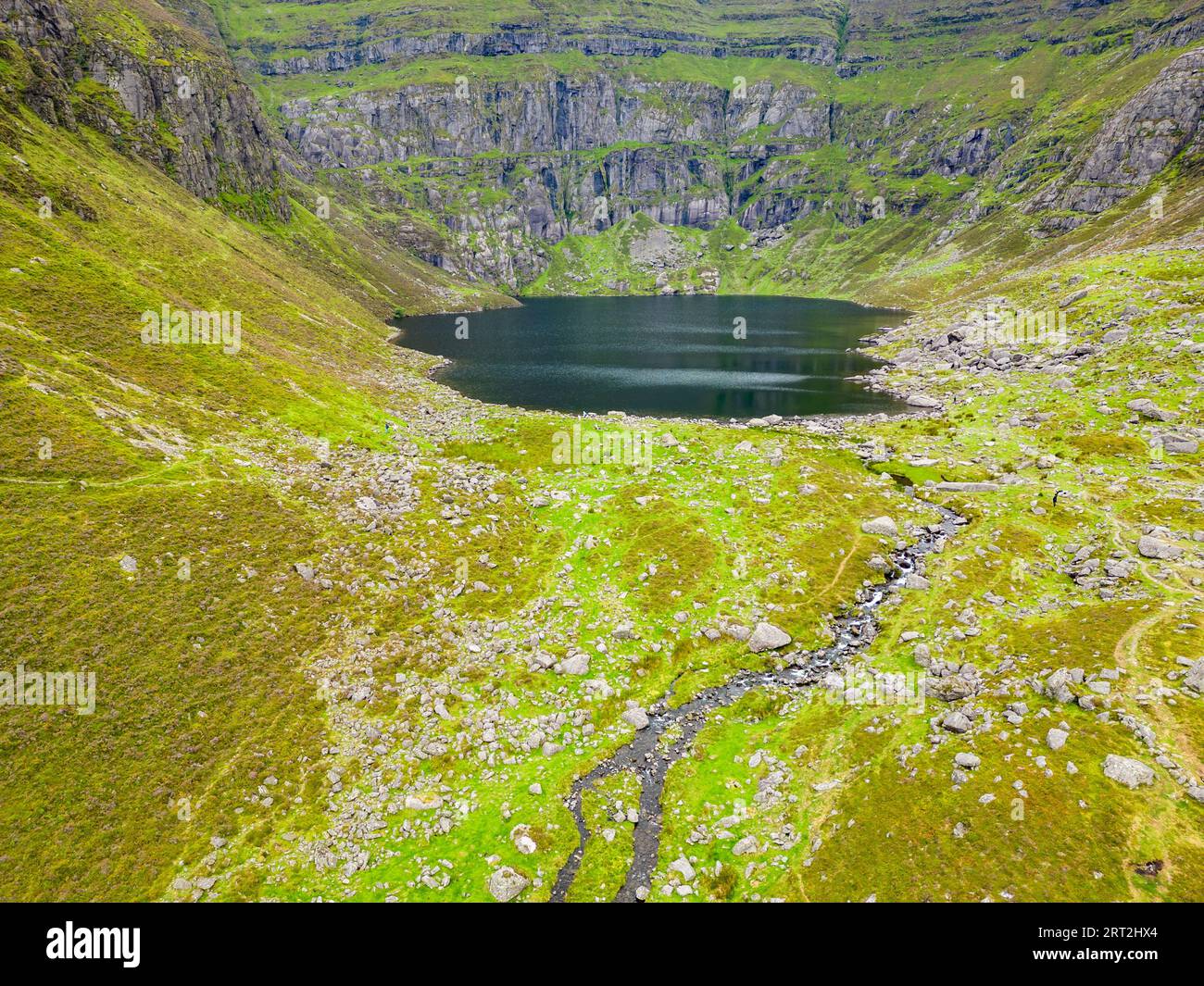 Aerial view of Coumshingaun Lough with rocks and vegetation, Waterford ...