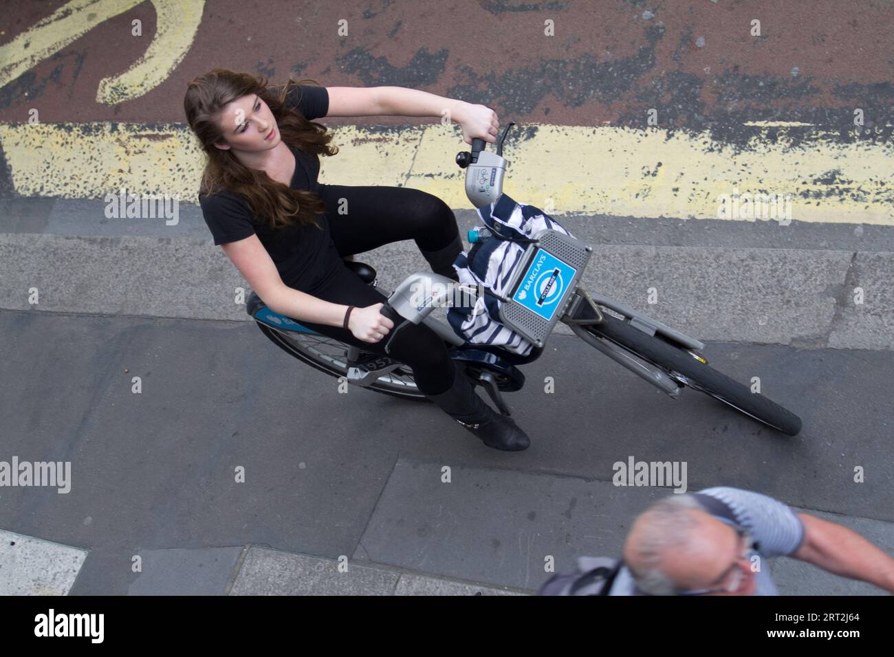 Female riding cycling Barclays Rental Boris bikes, london cycle rental scheme Stock Photo - Alamy