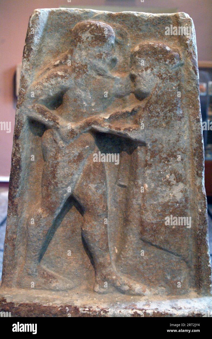 Man pointing his sword at a woman, from a Stele of the 6th century BC ...