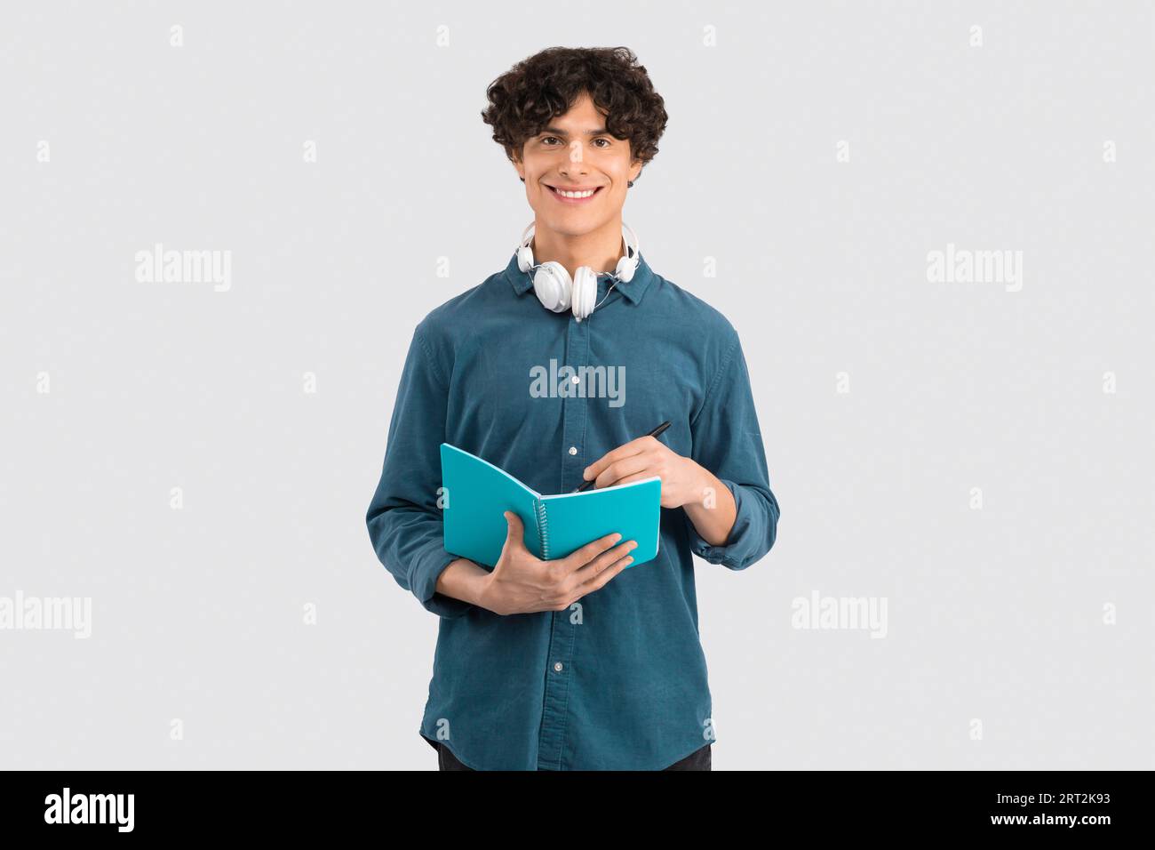 Male student taking copybook hi-res stock photography and images - Alamy