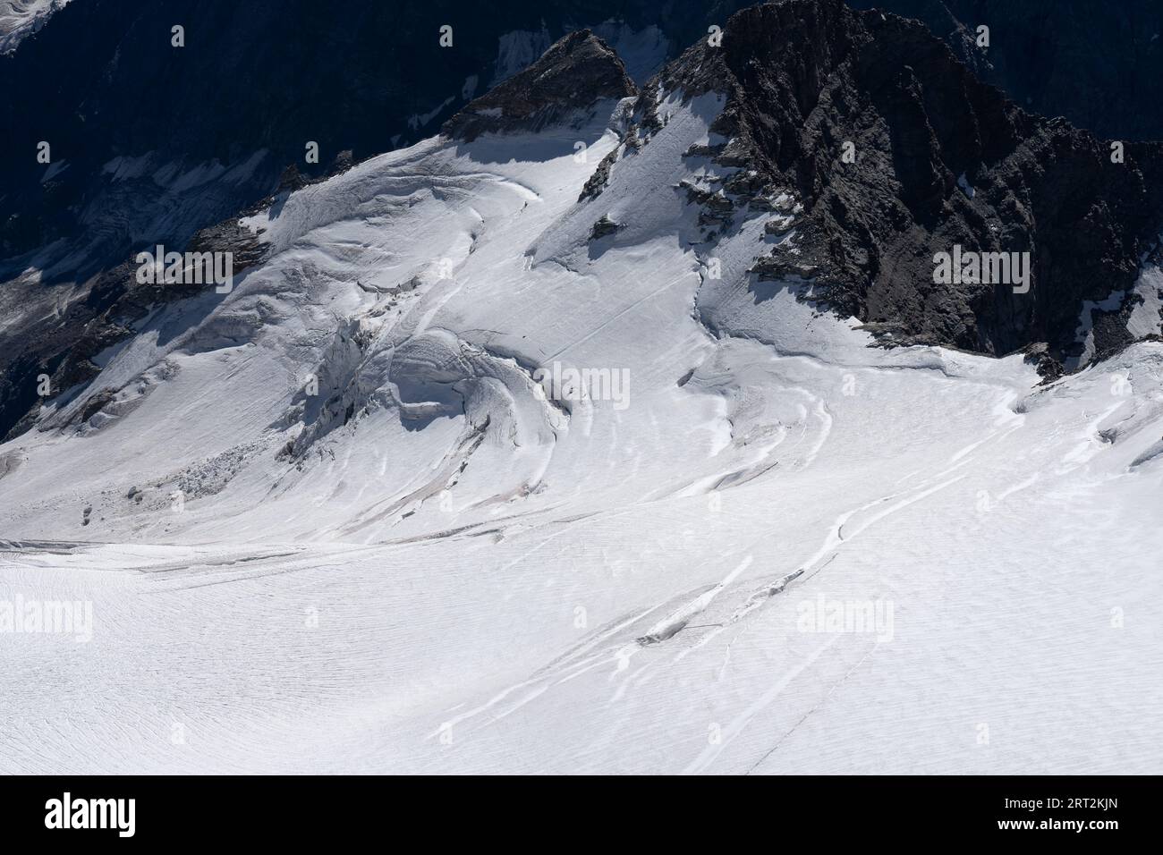 Glacier in the alpine mountains, crevasses and ice details. Gran ...