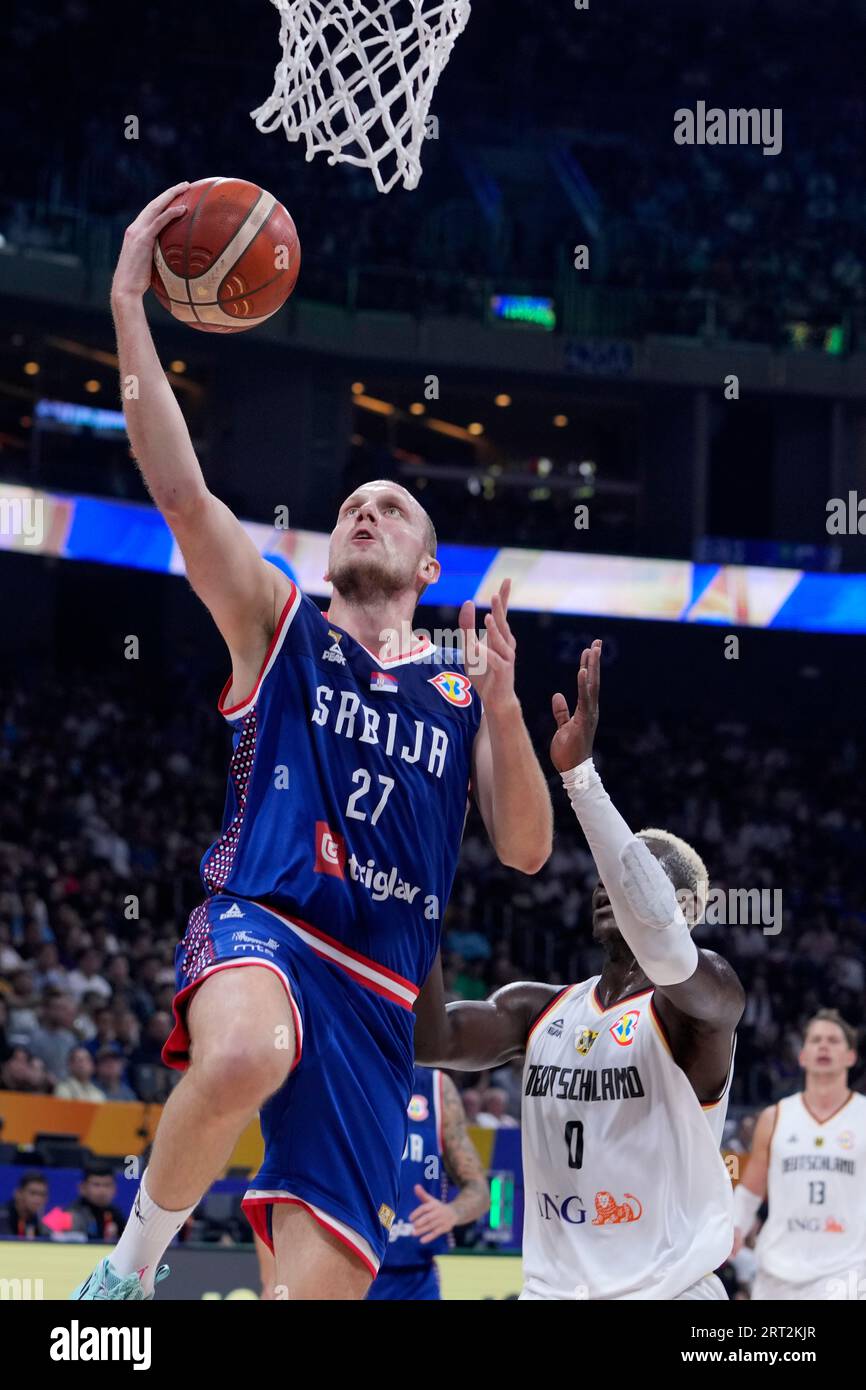 Serbia forward Dejan Davidovac (27) shoots over Germany guard Isaac ...