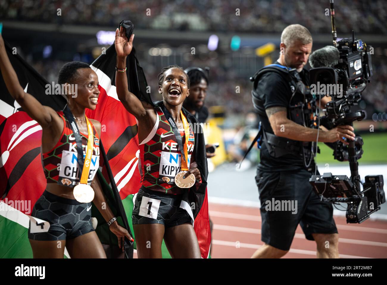 Faith Kipyegon and Beatrice Chebet celebrating hermedal with her ...