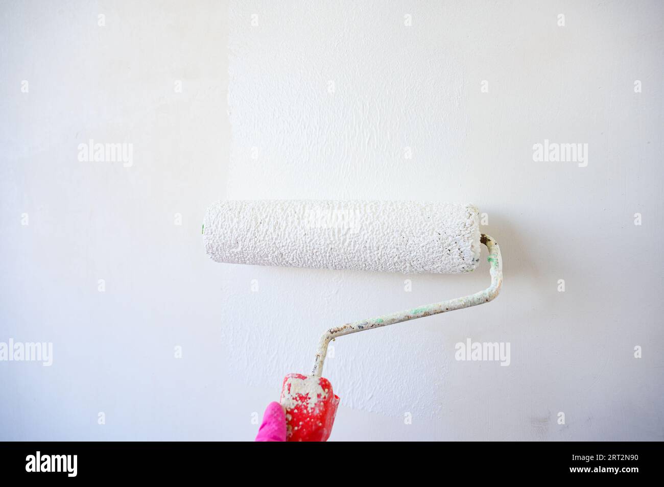 Painting apartment, renovating with white color paint Stock Photo - Alamy