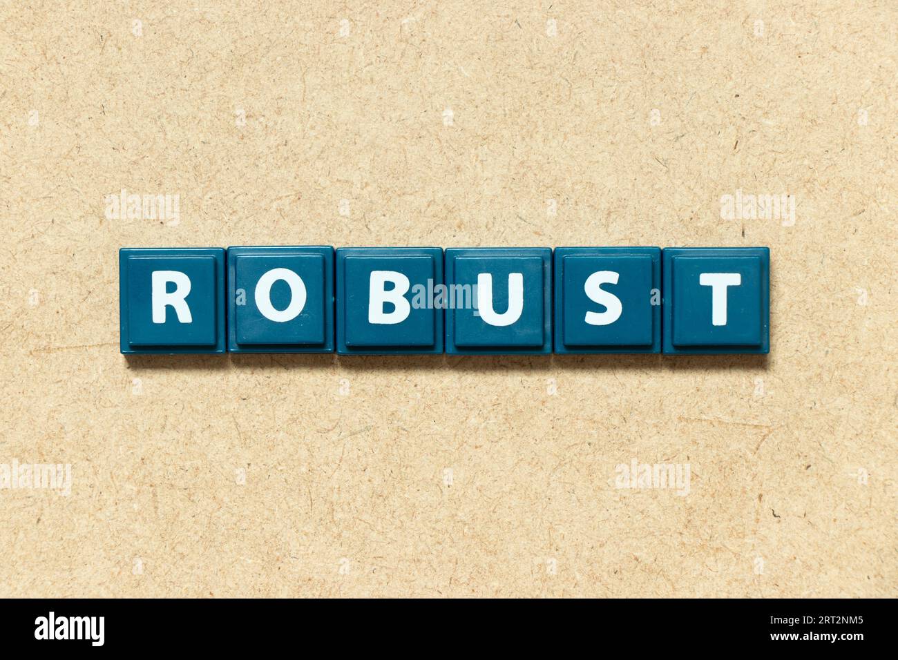 Tile alphabet letter in word robust on wood background Stock Photo - Alamy