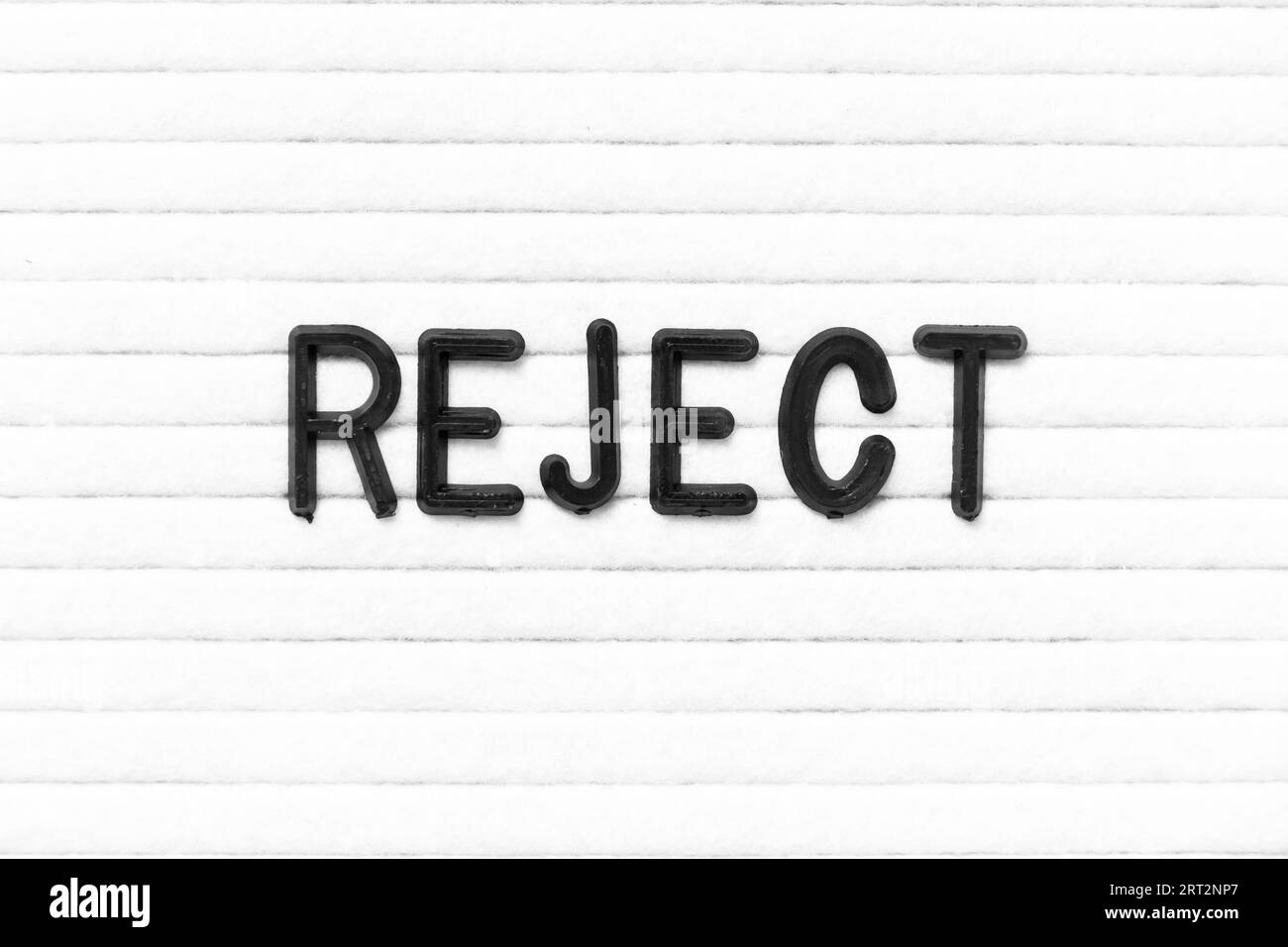 Black color letter in word reject on white felt board background Stock ...
