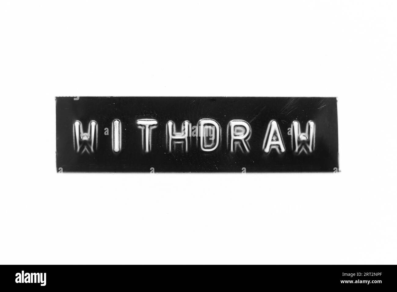 Black color banner that have embossed letter with word withdraw on ...