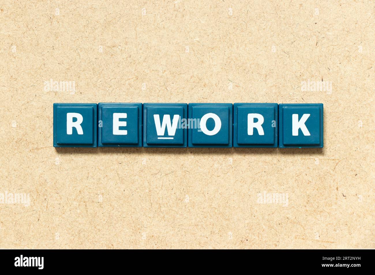 Tile alphabet letter in word rework on wood background Stock Photo - Alamy