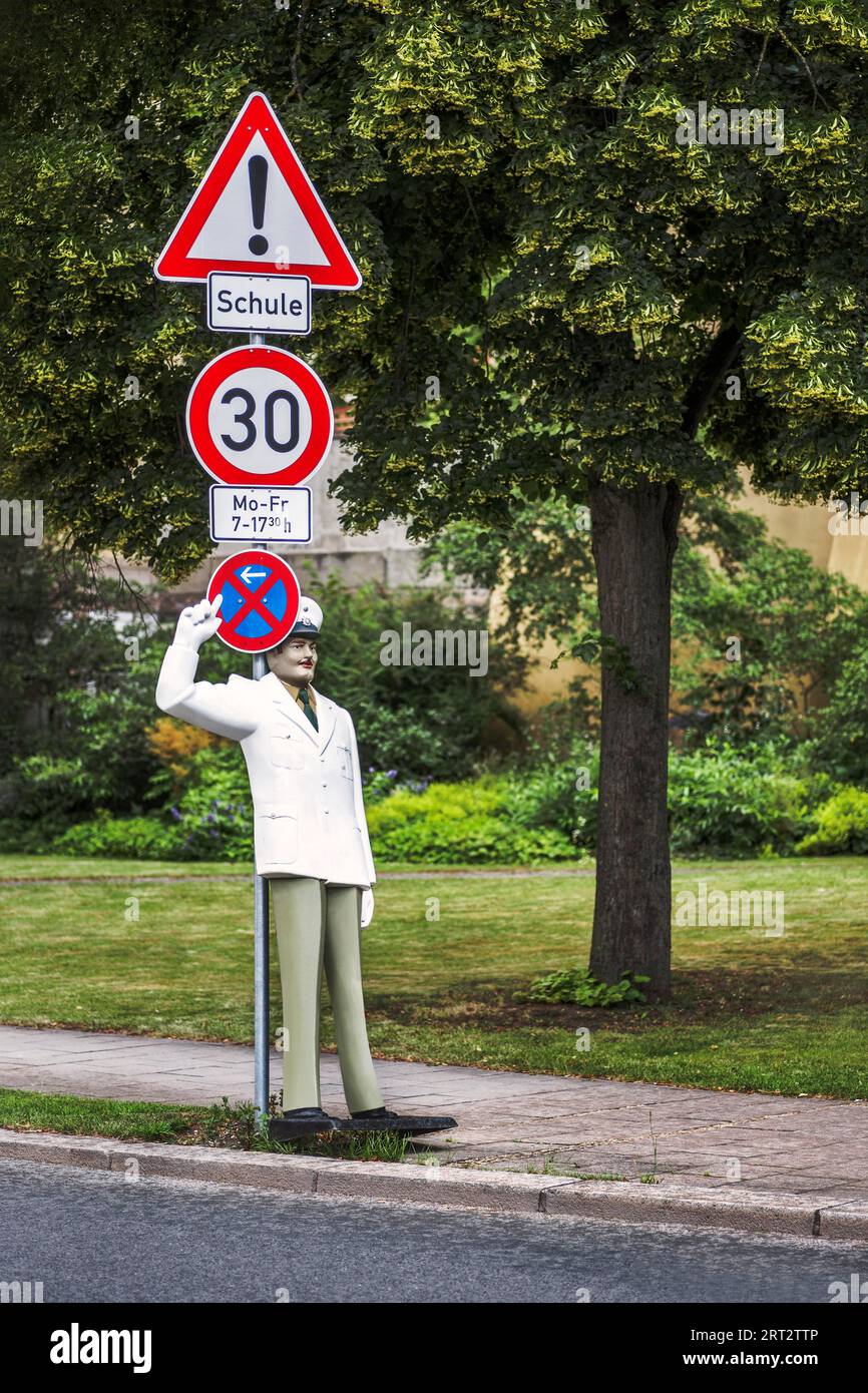 A police puppet points out many traffic signs Stock Photo - Alamy
