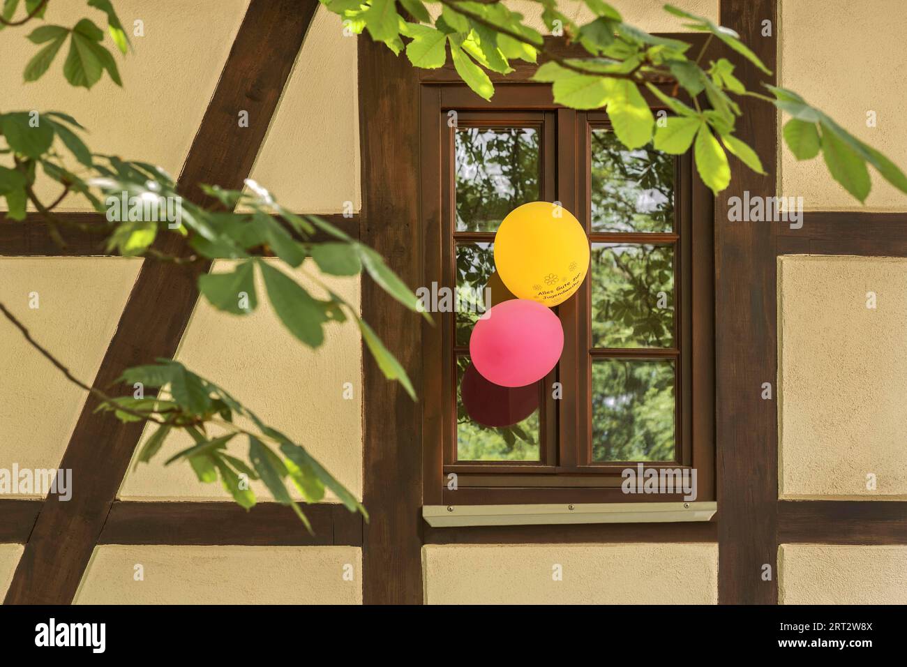 The balloons at the window Stock Photo - Alamy