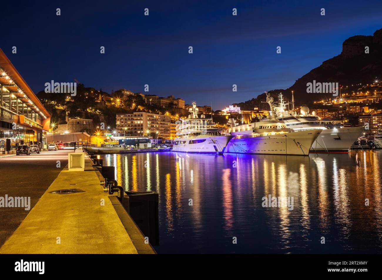 Monaco principality at night, luxury yachts at Port Hercules waterfront ...