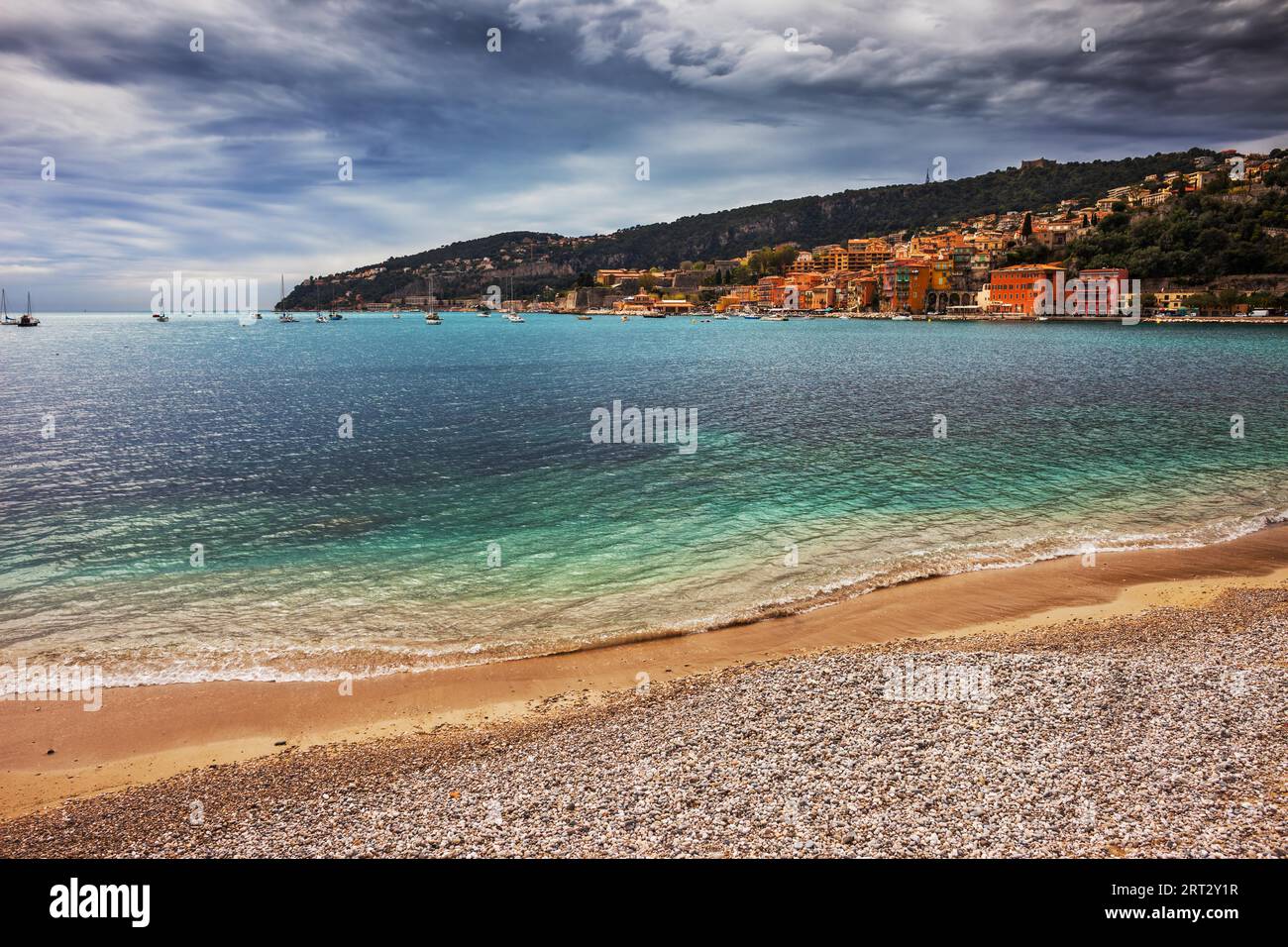 Beach and sea bay in Villefranche-sur-Mer resort on French Riviera in ...