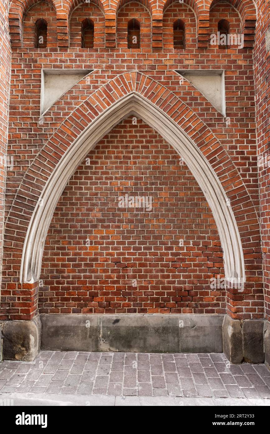 Gothic arch niche in brick wall, fortification in Old Town of Krakow ...