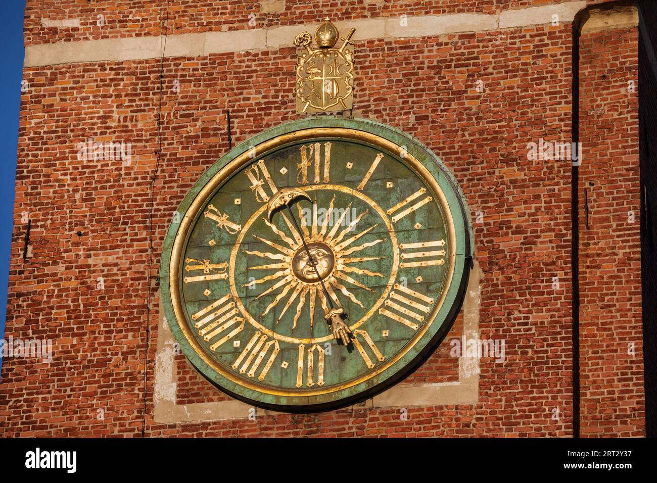 Wawel Cathedral clock on bell tower in Krakow, Poland, gilded sun in ...