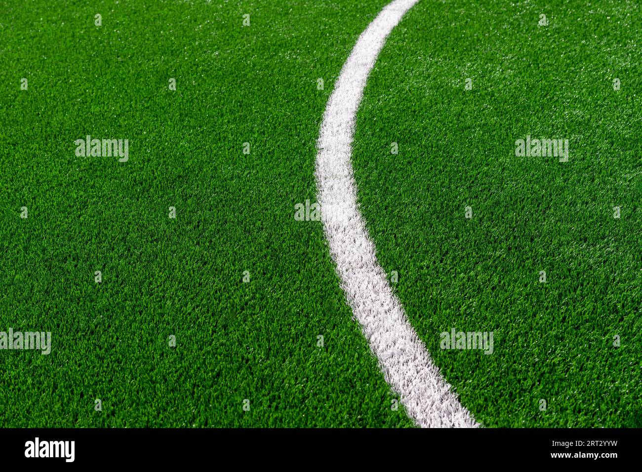 Green synthetic grass sports field with white line shot from above ...