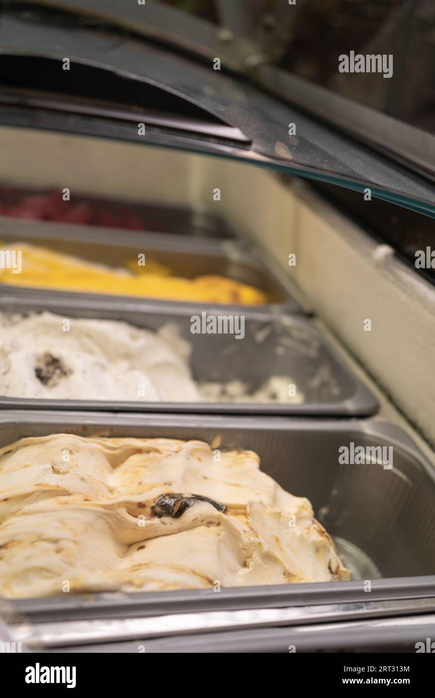 Traditional Italian artisan ice cream gelato at showcase in the fridge ...