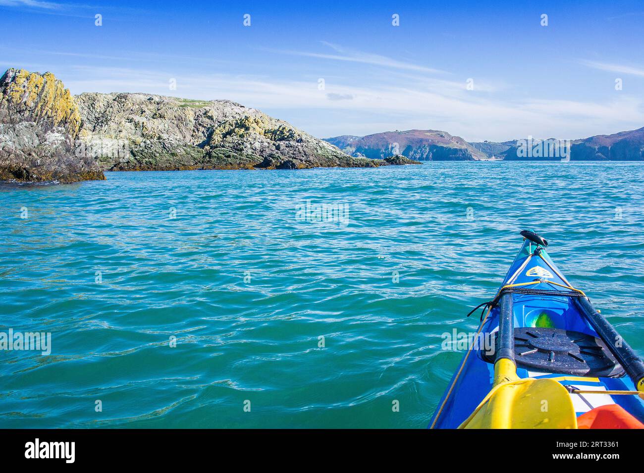 Sea kayaking off Middle Mouse on the north coast of Anglesey, Wales ...