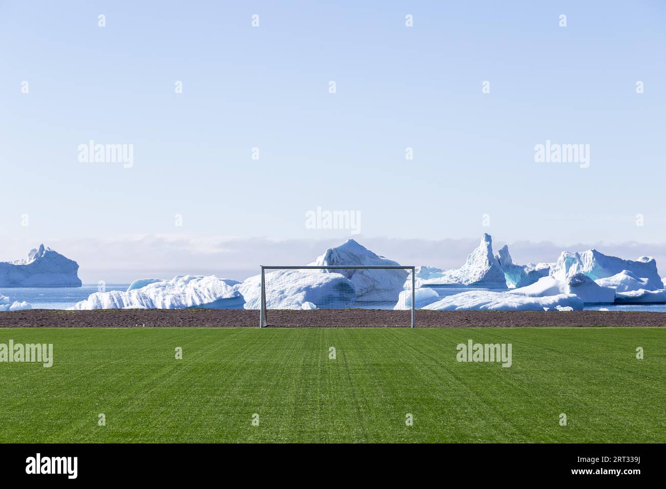 Qeqertarsuaq, Greenland, July 6, 2018: The soccer field with icebergs ...
