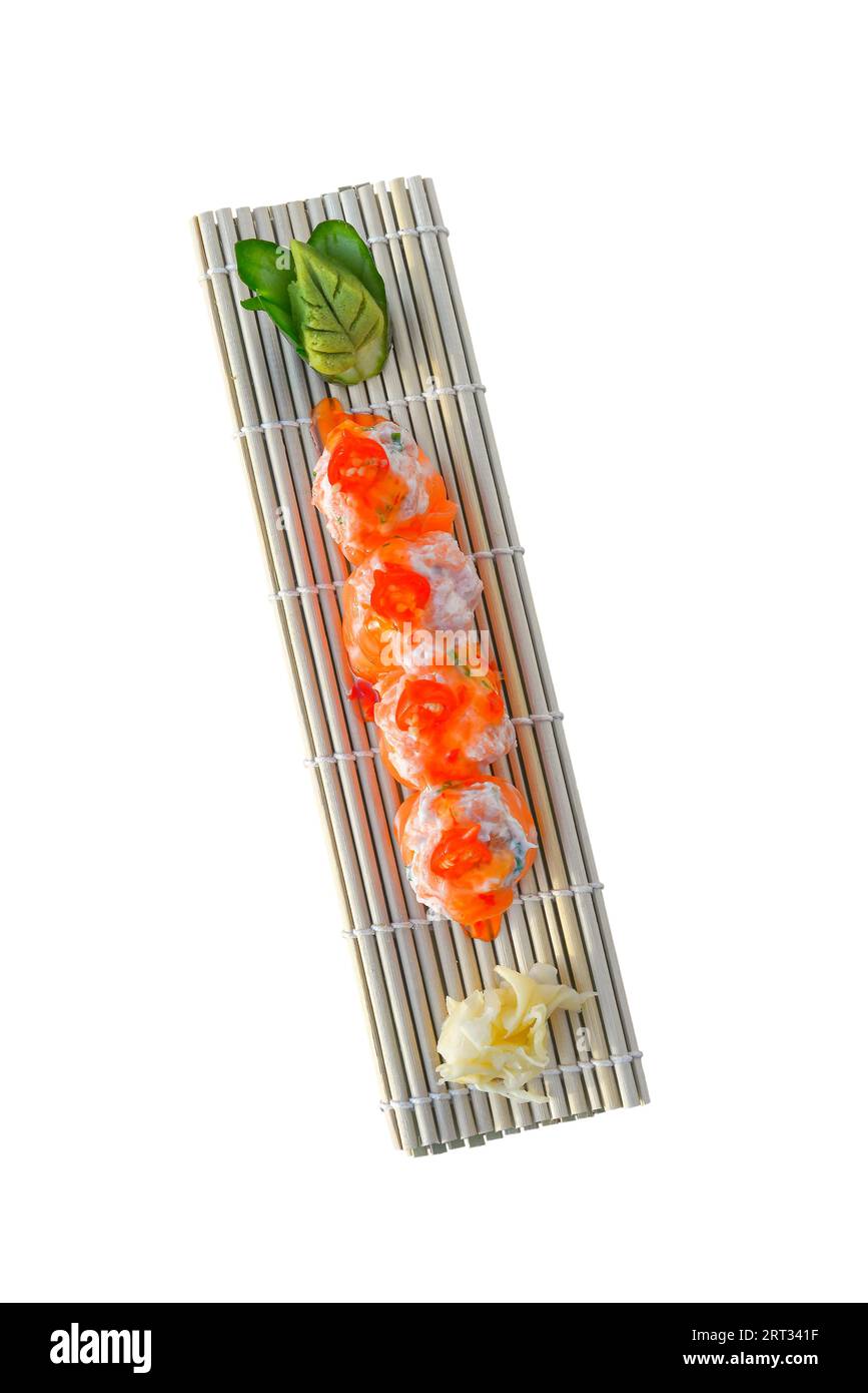 Salmon sashimi roll with sauce and peper pout. Japanese food isolated ...