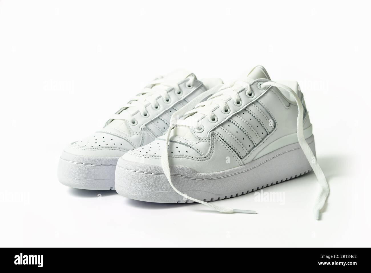 White tennis shoes isolated on white background Stock Photo - Alamy