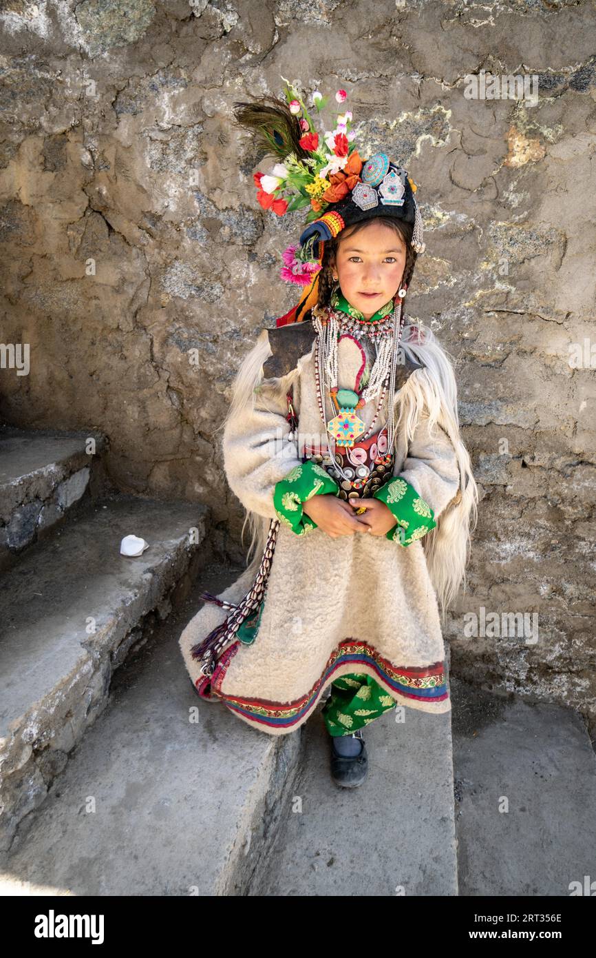 Ladakh, India, August 29, 2018: Indigenous girl in traditional costume ...