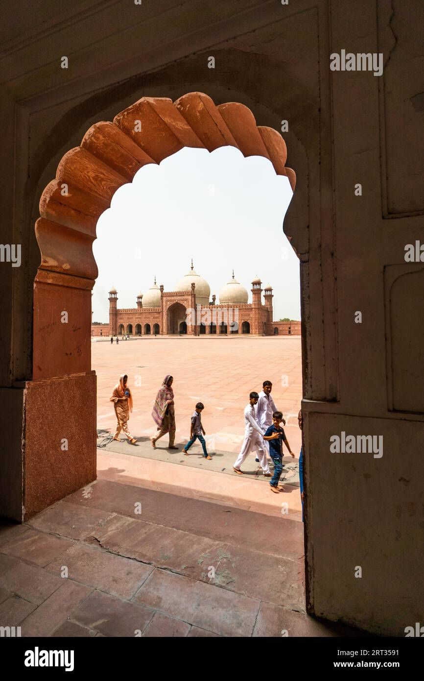 Lahore, Pakistan, August 5, 2018: Tourists walking in front of Badshahi ... Lahore, Pakistan, August 5, 2018: Tourists walking in front of Badshahi ...