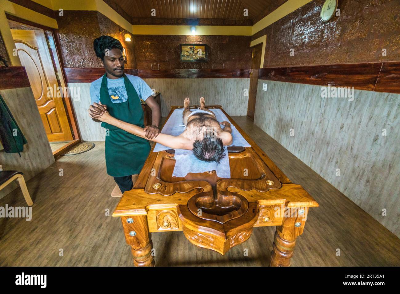 Karnataka, India, August 20, 2018: Young man undertaking a massage in ...