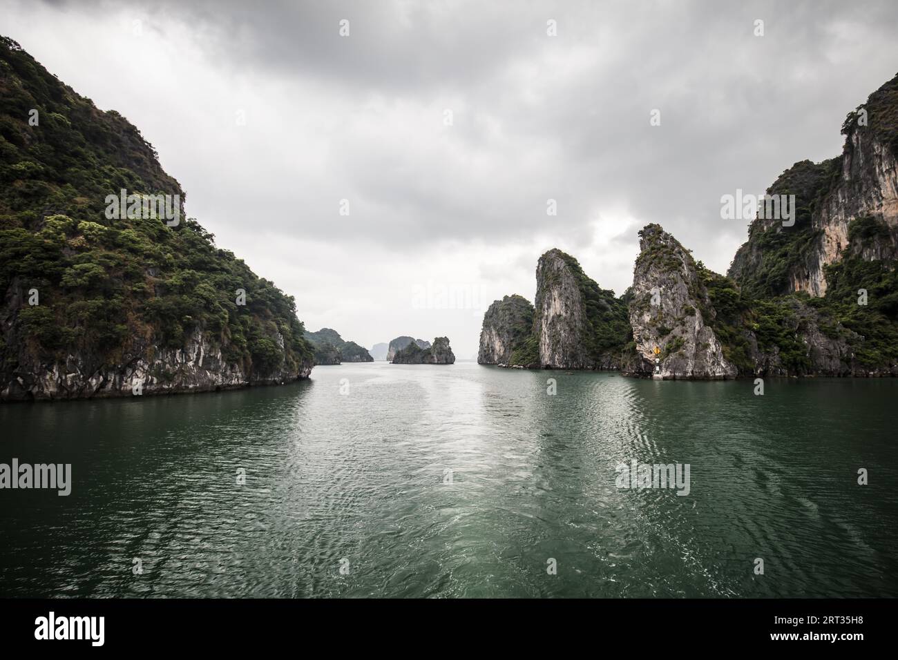 View throughout the islands of Ha Long Bay on a stormy summers day in ...